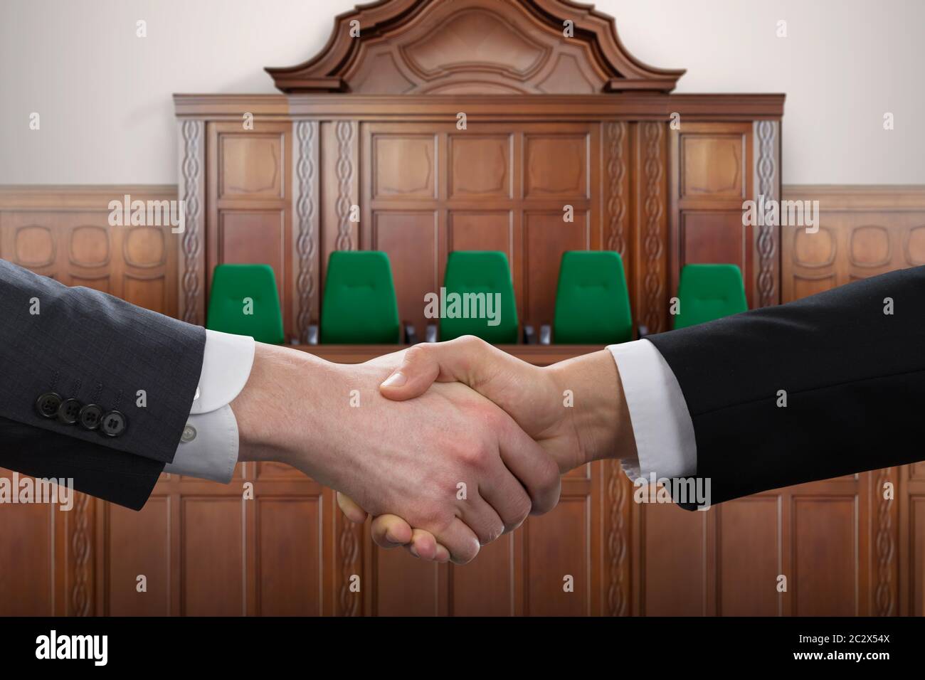 Lawyer And Client Shaking Hands At Courtroom Stock Photo - Alamy