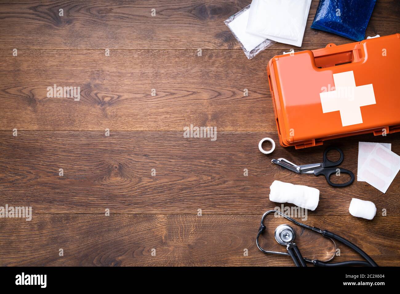 First Aid Kit With Medical Equipment On Wooden Background Stock Photo ...