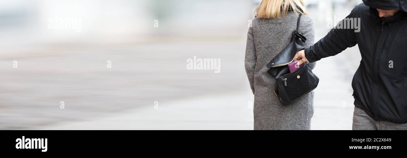 Thief stealing purse from handbag hi-res stock photography and images ...