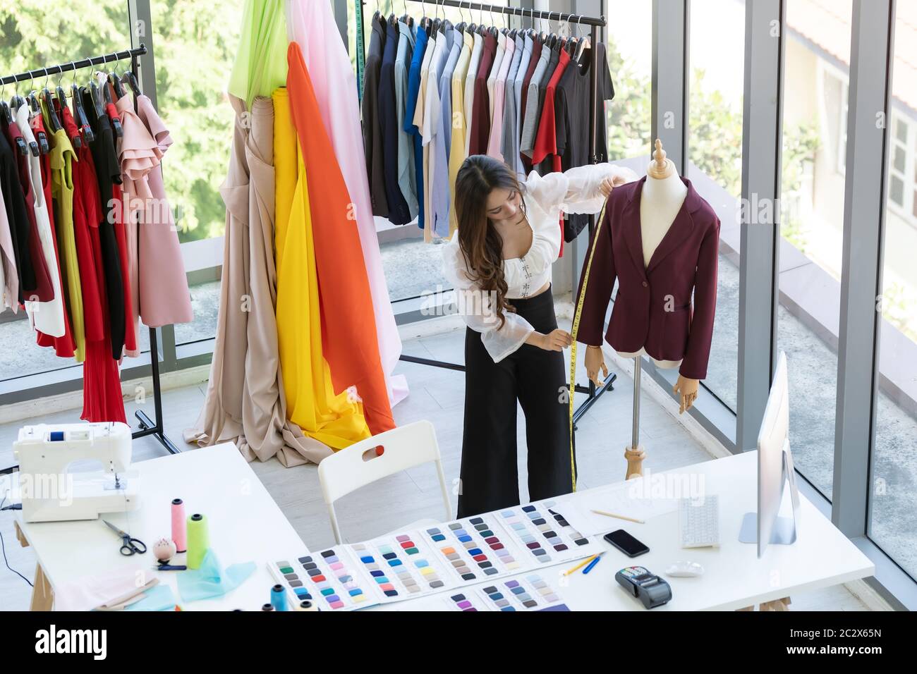Fashion designer owner working Stock Photo - Alamy