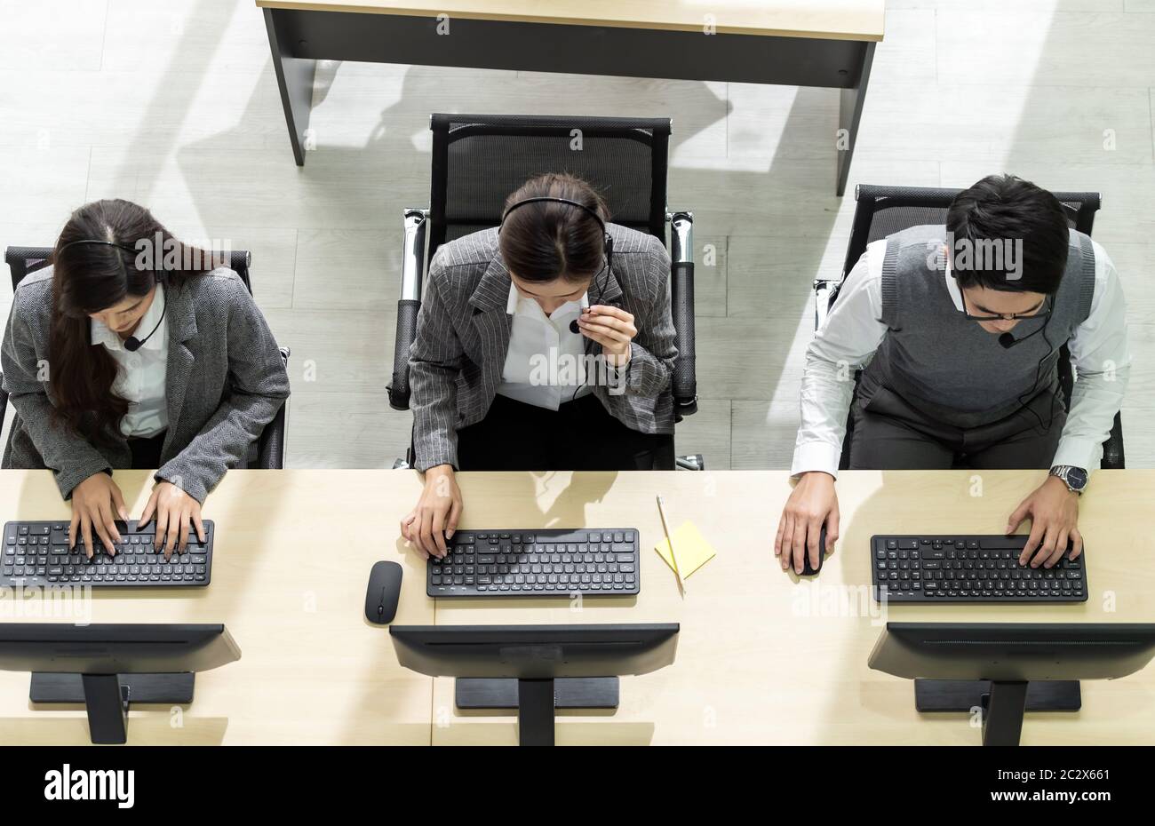 Call center team working top view Stock Photo - Alamy