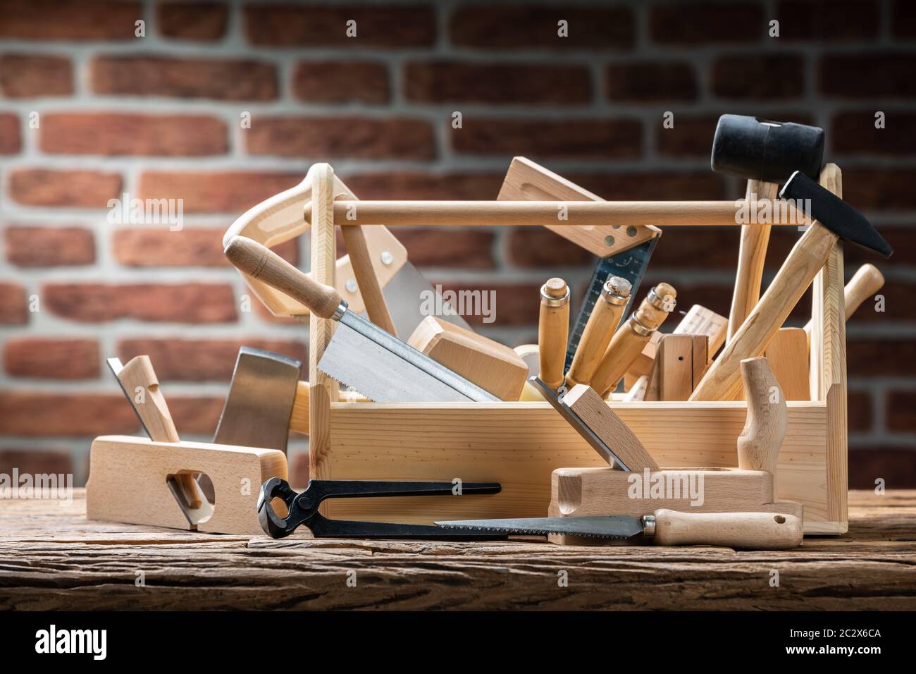 Toolbox With Carpenter Worktools Against Brick Background Stock Photo ...