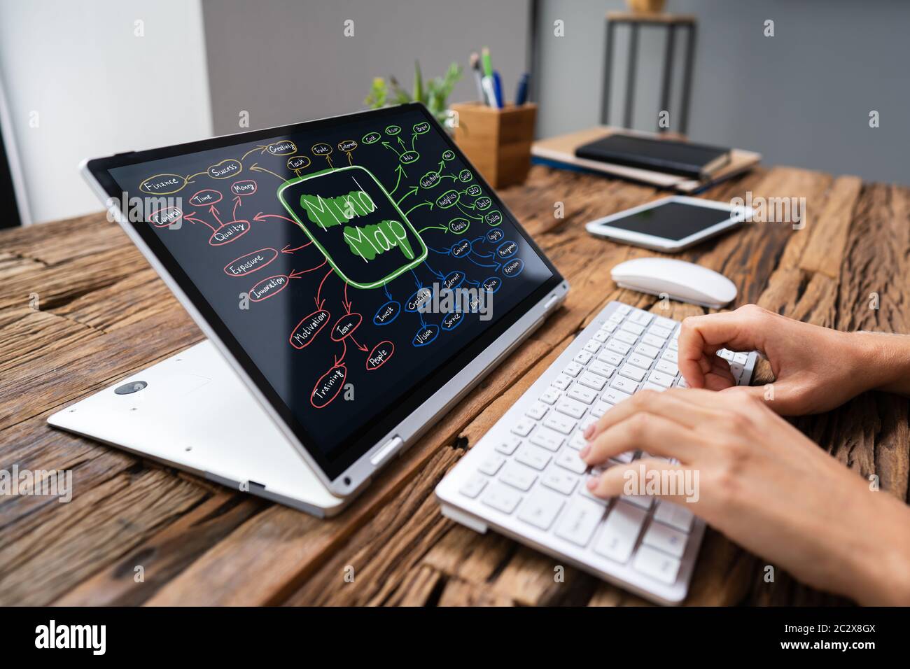 Businesswoman Working On Laptop Making Mind Map At Wooden Desk Stock ...