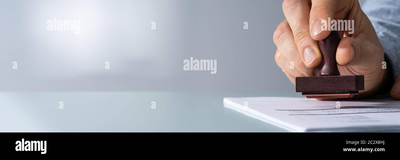 Persons hand stamping approved hi-res stock photography and images - Alamy