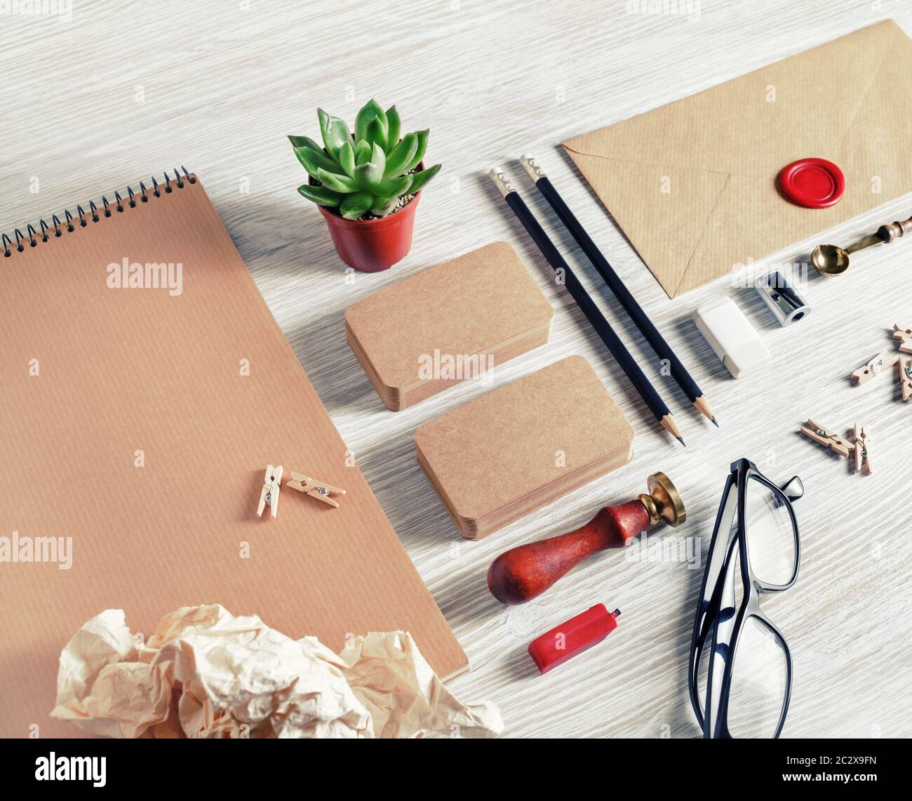 Blank kraft paper stationery set on light wood table background ...
