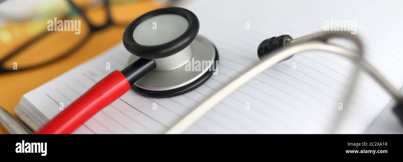 On table is notebook for notes and stethoscope Stock Photo - Alamy