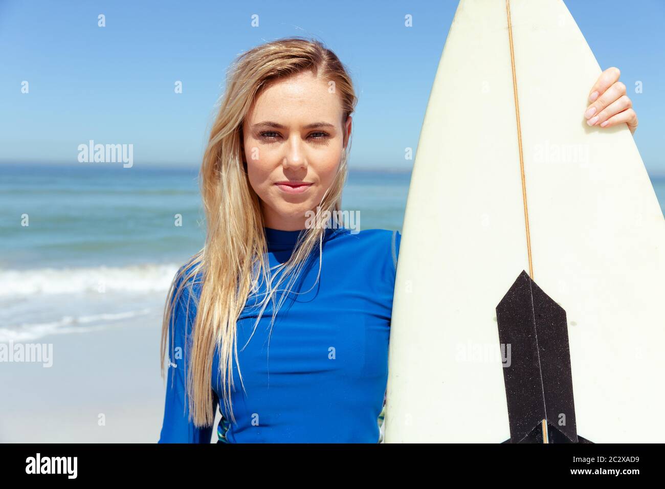 Caucasian woman during surf session at beach Stock Photo - Alamy