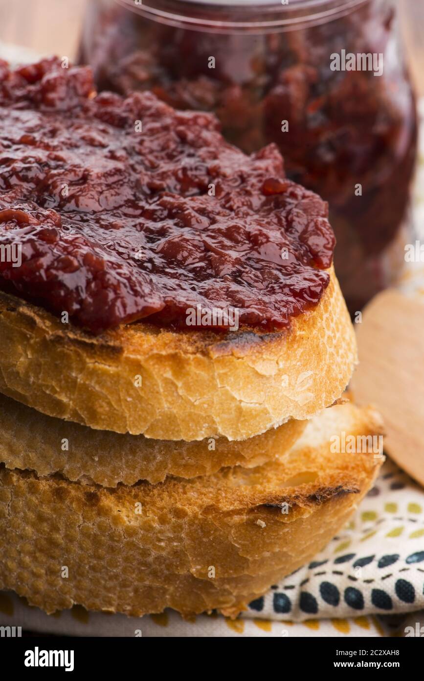 Bread with sweet cherry jam Stock Photo - Alamy