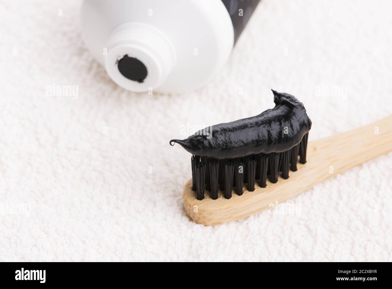 Brush with black toothpaste hi-res stock photography and images - Alamy
