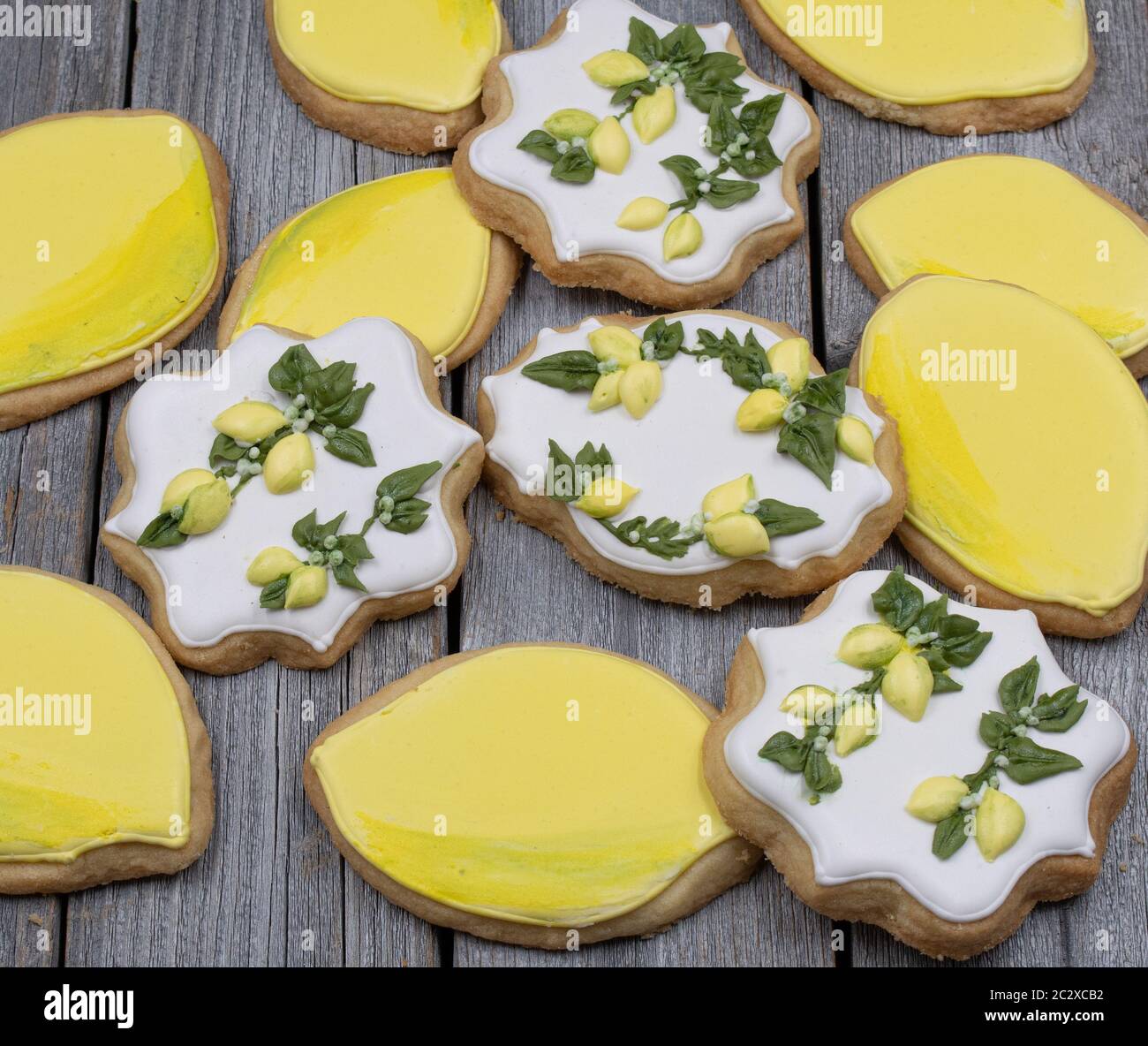 Lemon cookies decorated with royal icing on wooden background Stock ...