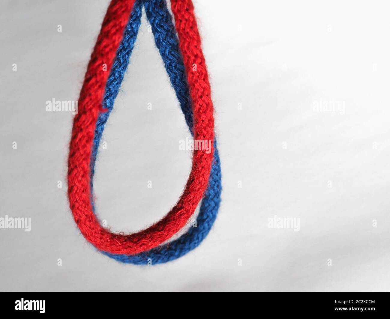 red and blue rope over off white background Stock Photo - Alamy