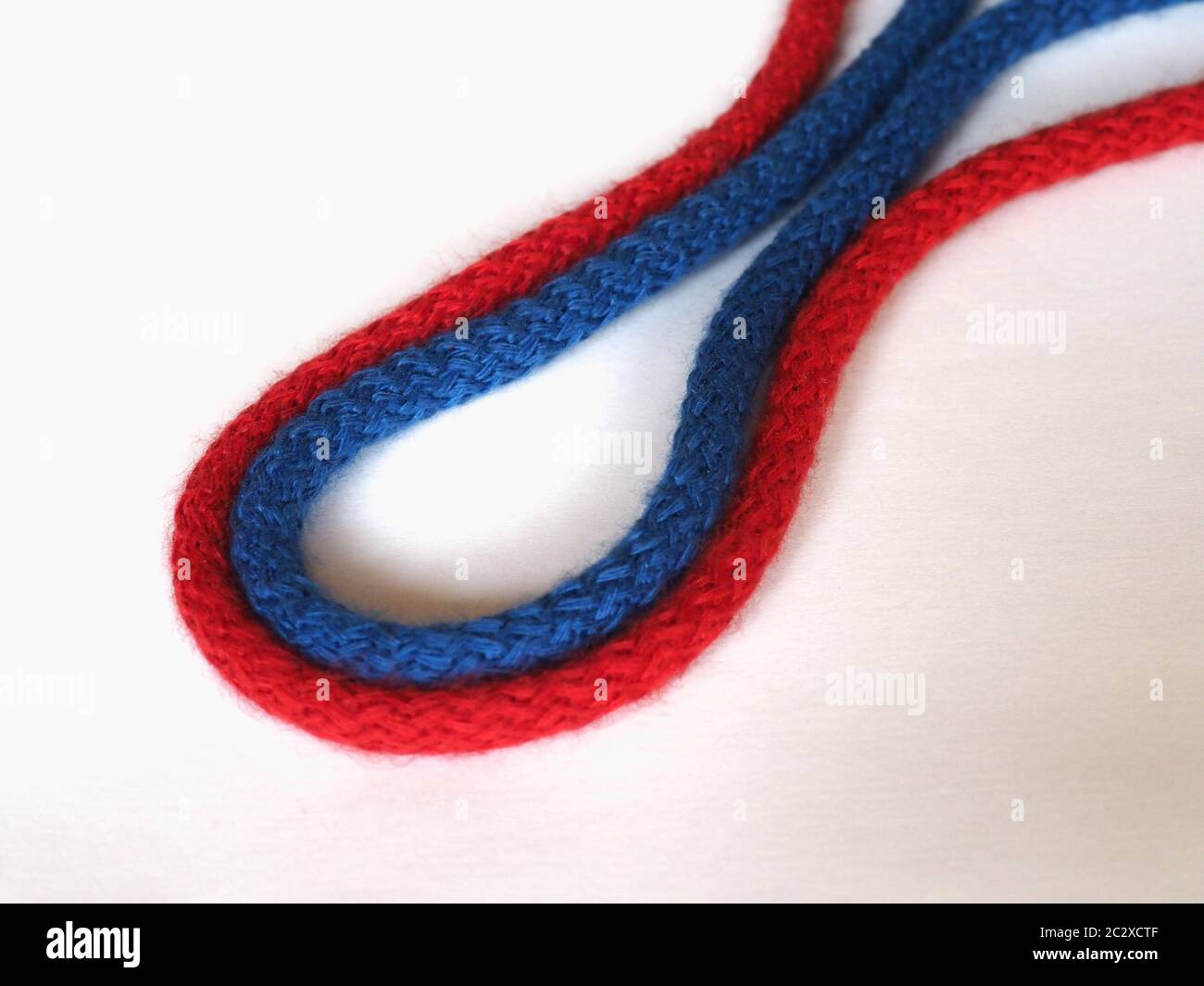 red and blue rope over off white background Stock Photo - Alamy