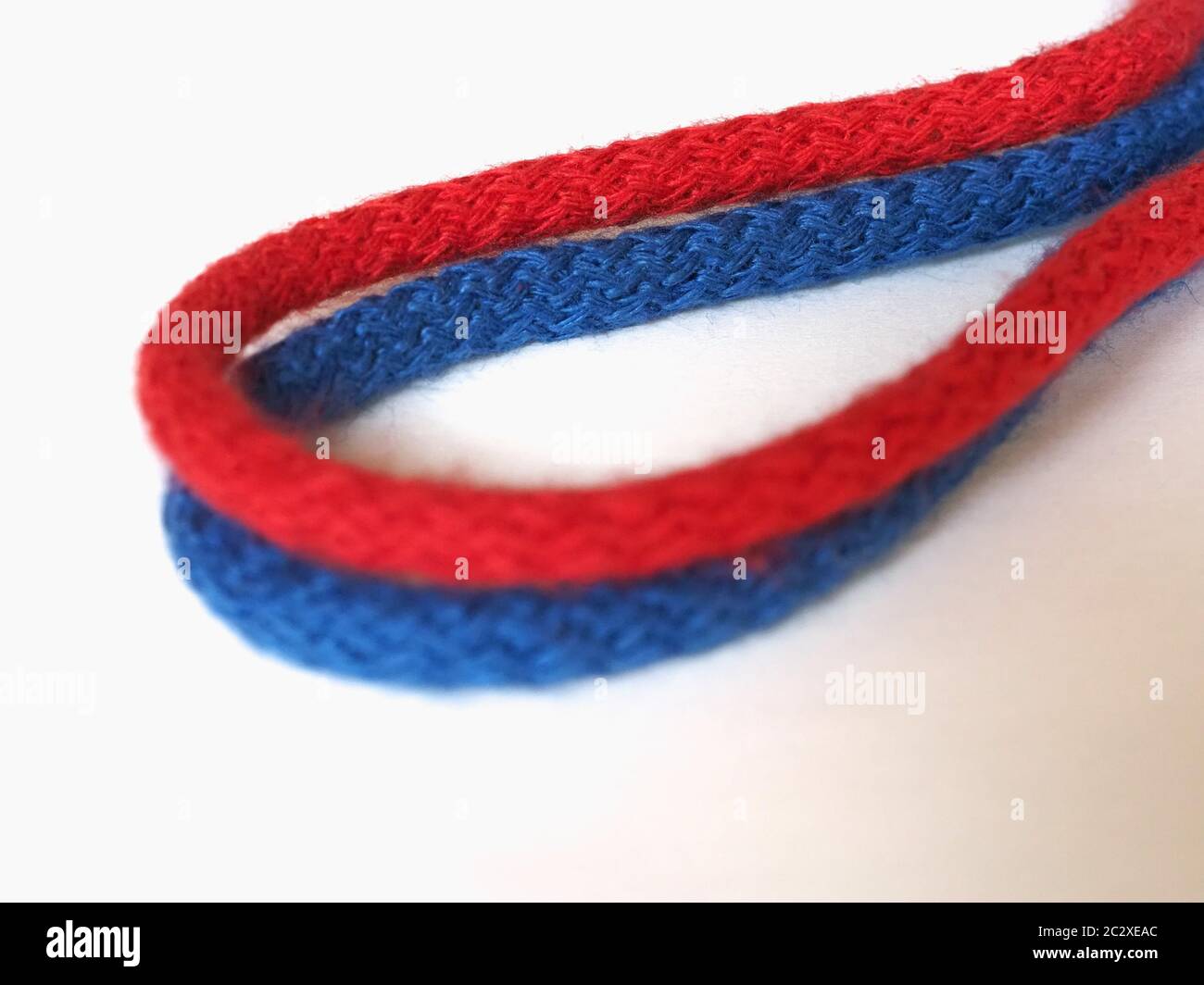 red and blue rope over off white background Stock Photo - Alamy