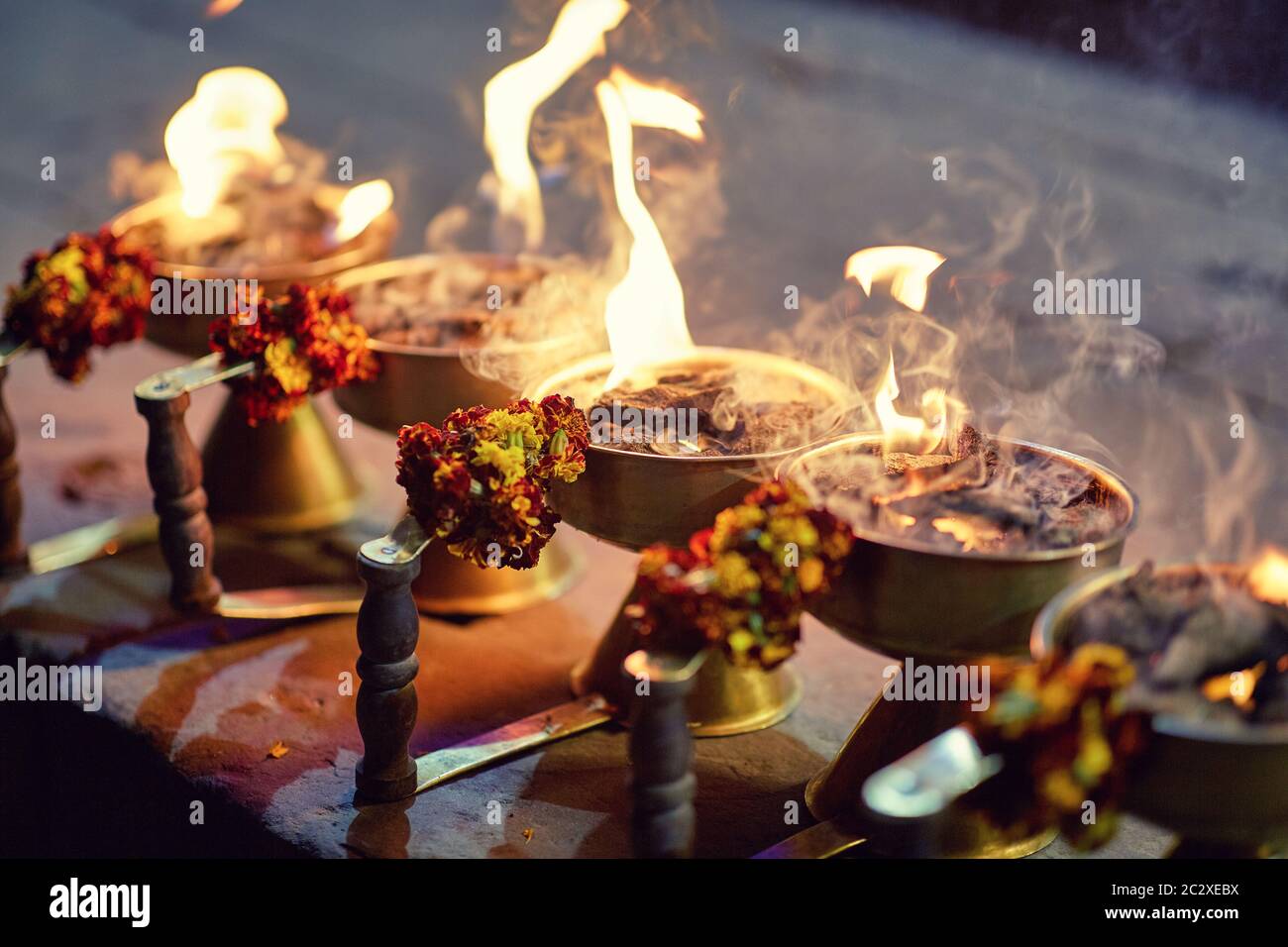 Aarti ceremony flowers with fire in Varanasi Stock Photo - Alamy