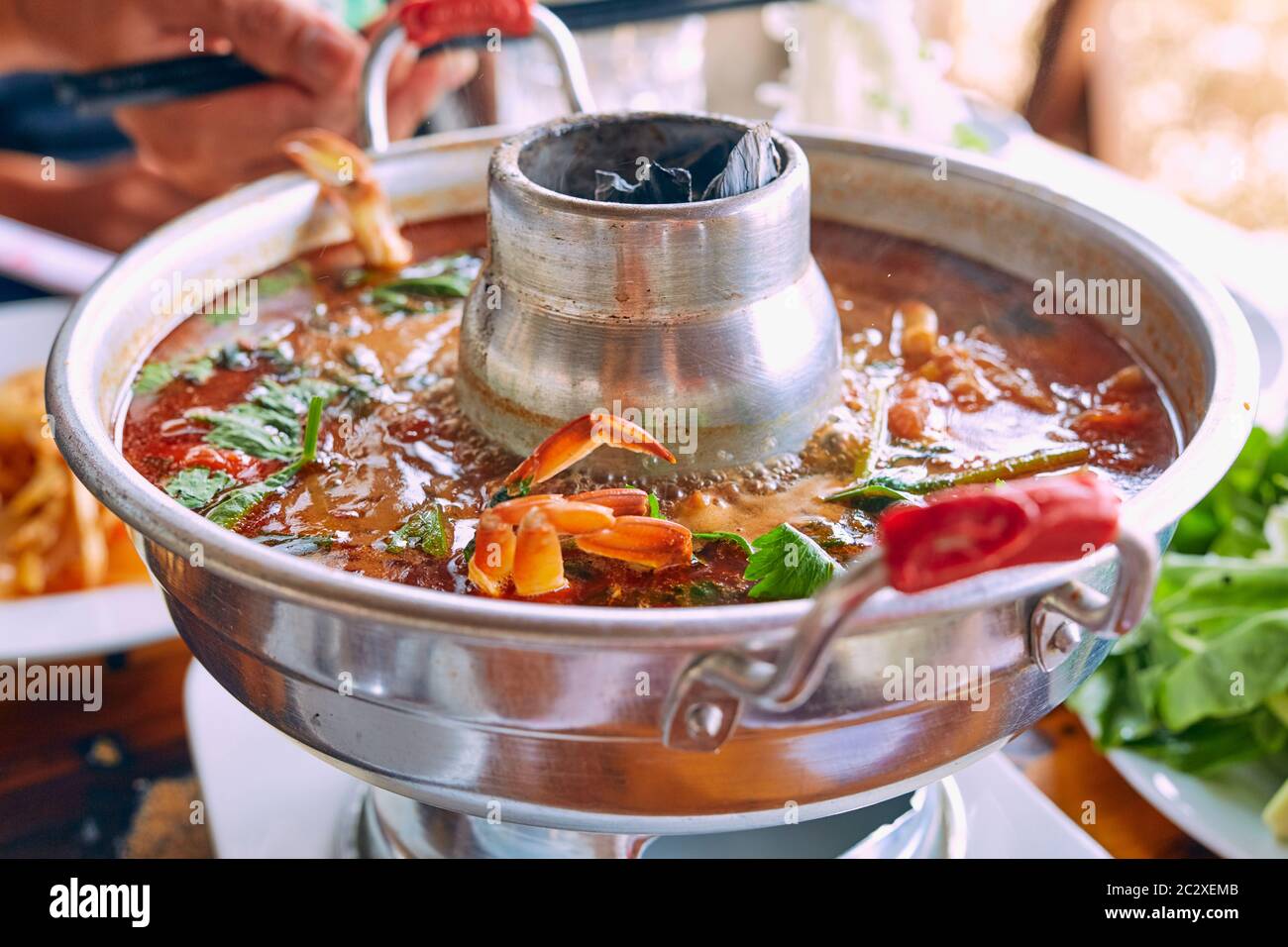 Vietnamese seafood in a pot boiling with crab and spices Stock Photo ...