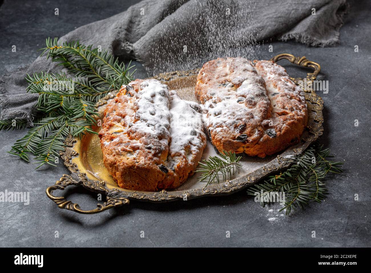 Traditional Stollen sprinkled with powdered sugar Stock Photo - Alamy