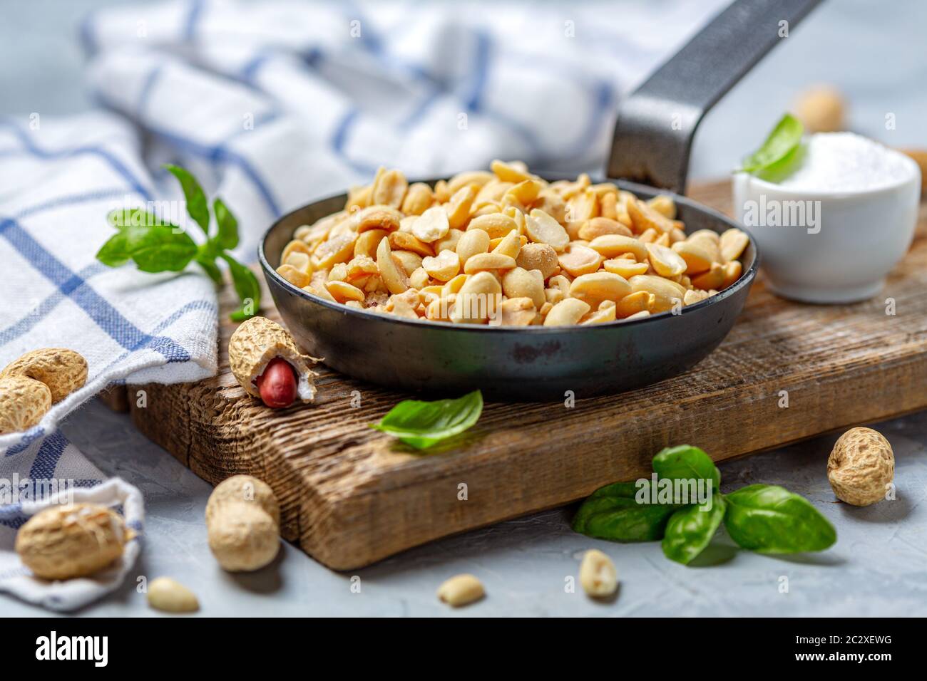 Delicious salted peanuts in a frying pan Stock Photo - Alamy
