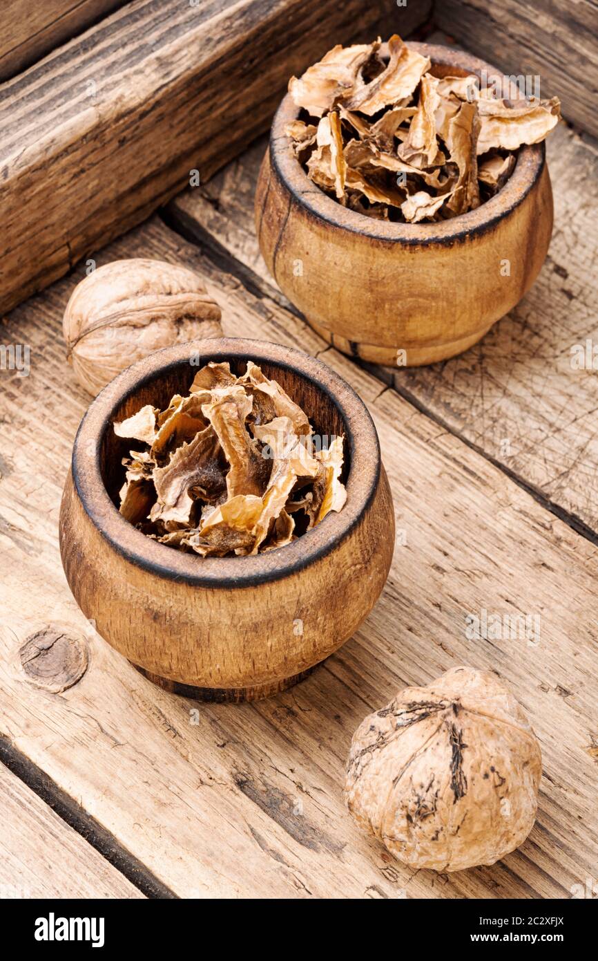 Walnut partitions on wooden table.Healing properties of walnuts.Walnut ...