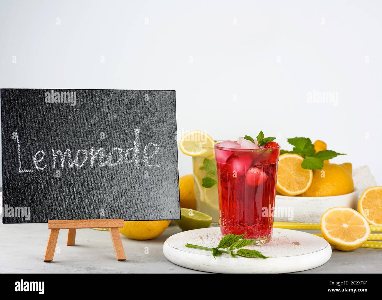 black chalk board for writing a summer drink recipe and a glass with ...