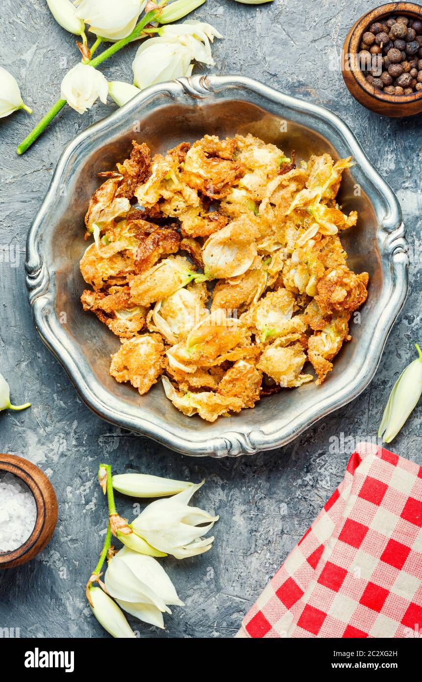 Fried yucca flowers.An unusual dish of edible flowers Stock Photo - Alamy