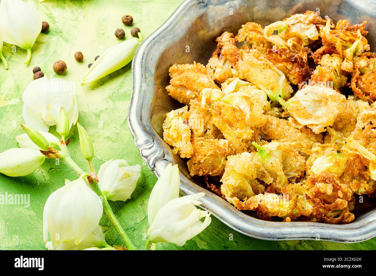 Fried yucca flowers.An unusual dish of edible flowers Stock Photo - Alamy
