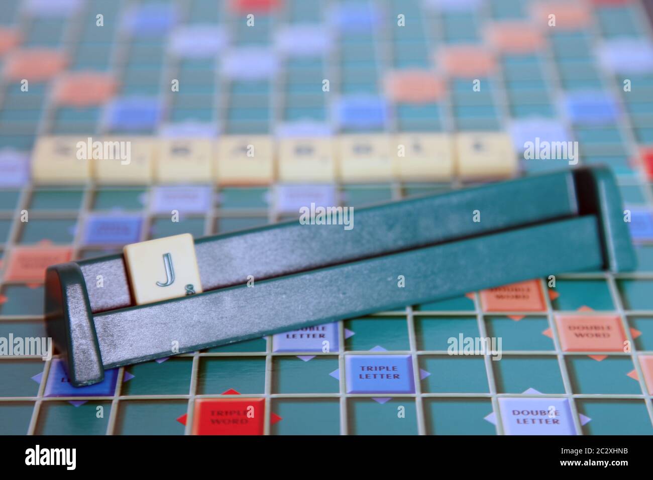 Scrabbles letters tile - letter character J Stock Photo - Alamy