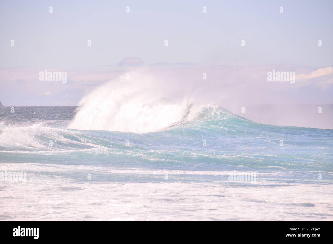 Big Blue Wave Breaks in the Atlantic Ocean Stock Photo - Alamy
