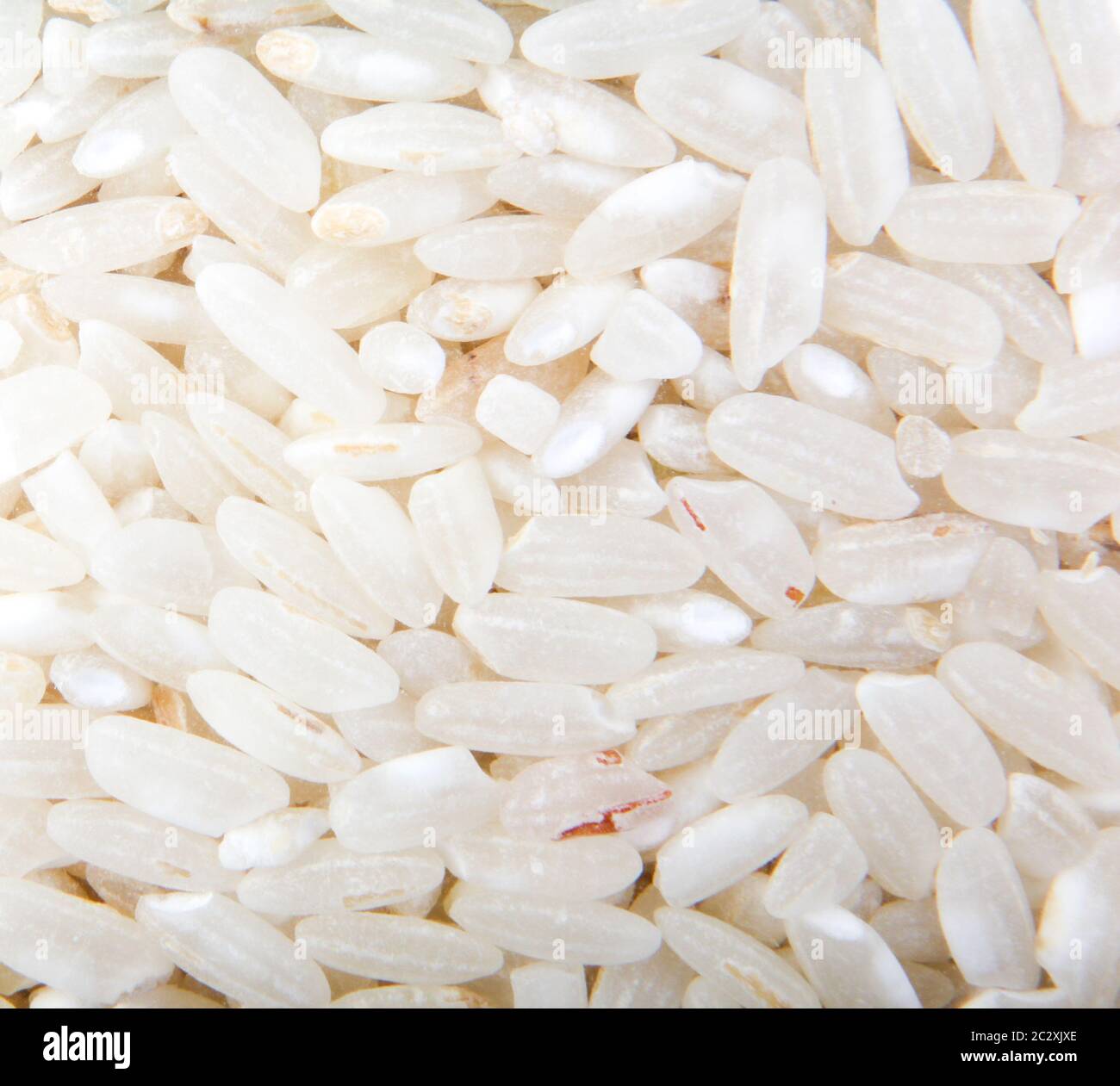 Close-Up Of White Rice Background Stock Photo - Alamy