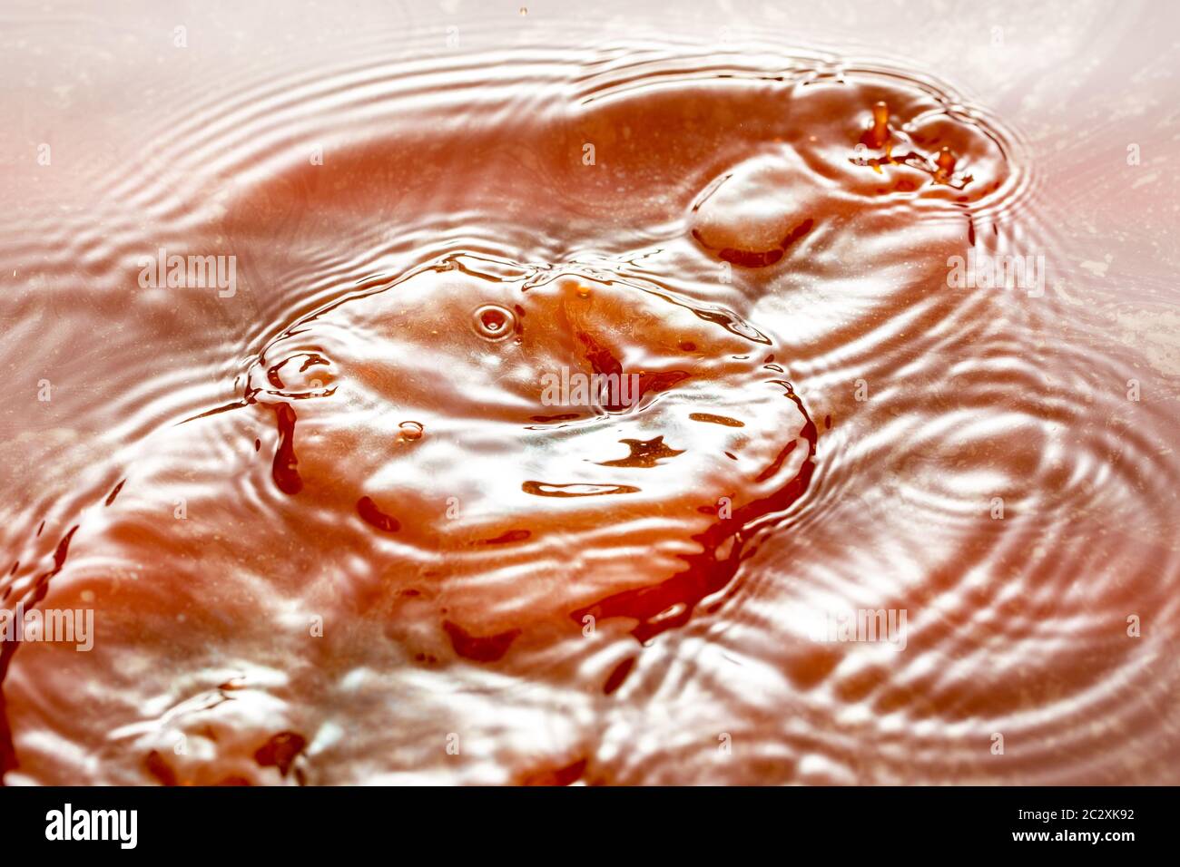 Rusty water drops splashing in dirty oily water, drops of stagnant ...