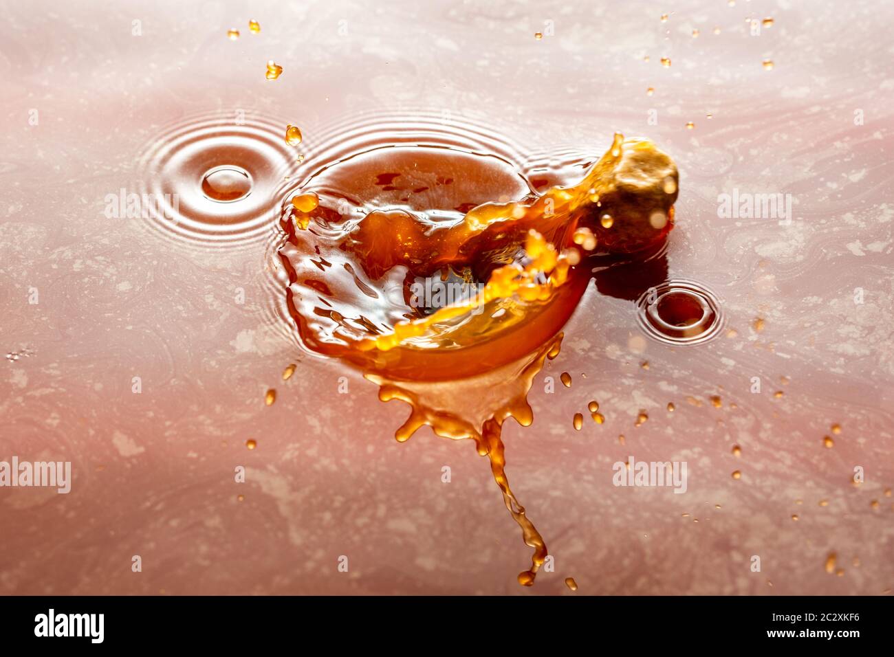 Rusty water drops splashing in dirty oily water, drops of stagnant ...