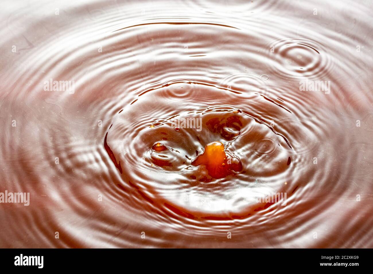Rusty water drops splashing in dirty oily water, drops of stagnant ...