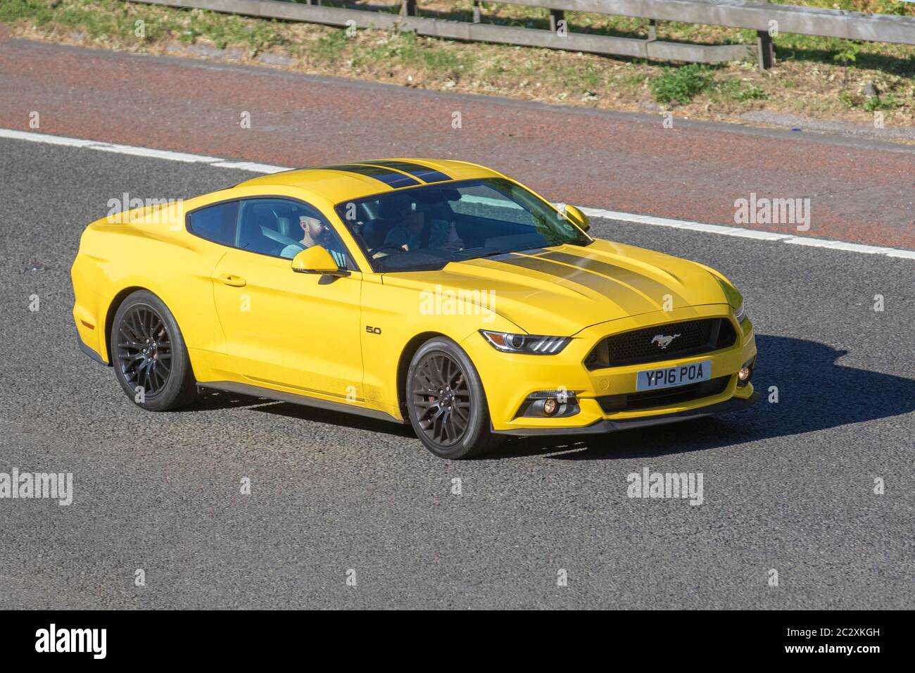 2016 yellow Ford Mustang GT 5L; Vehicular traffic moving vehicles, cars ...