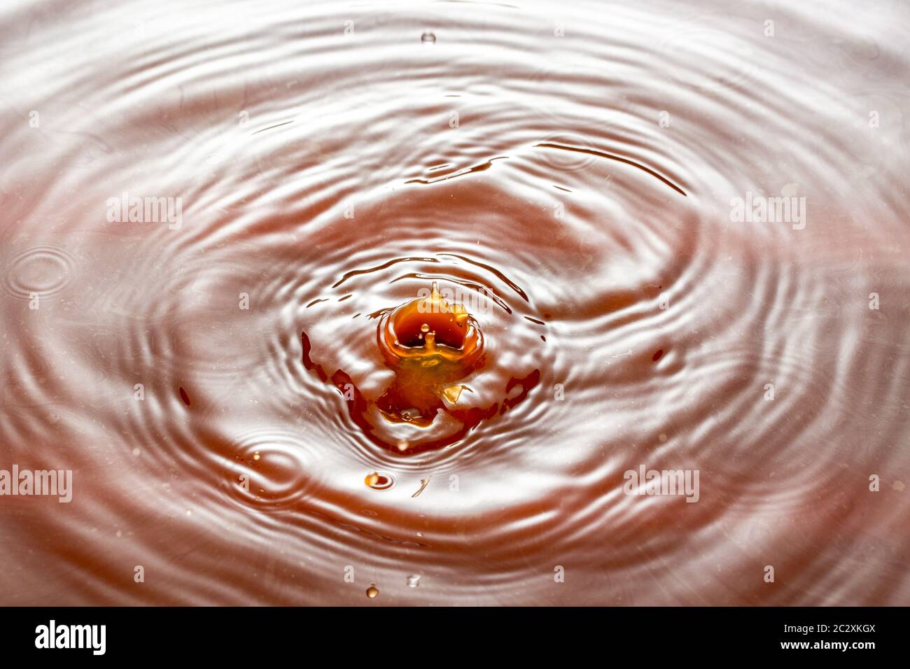 Rusty water drops splashing in dirty oily water, drops of stagnant ...