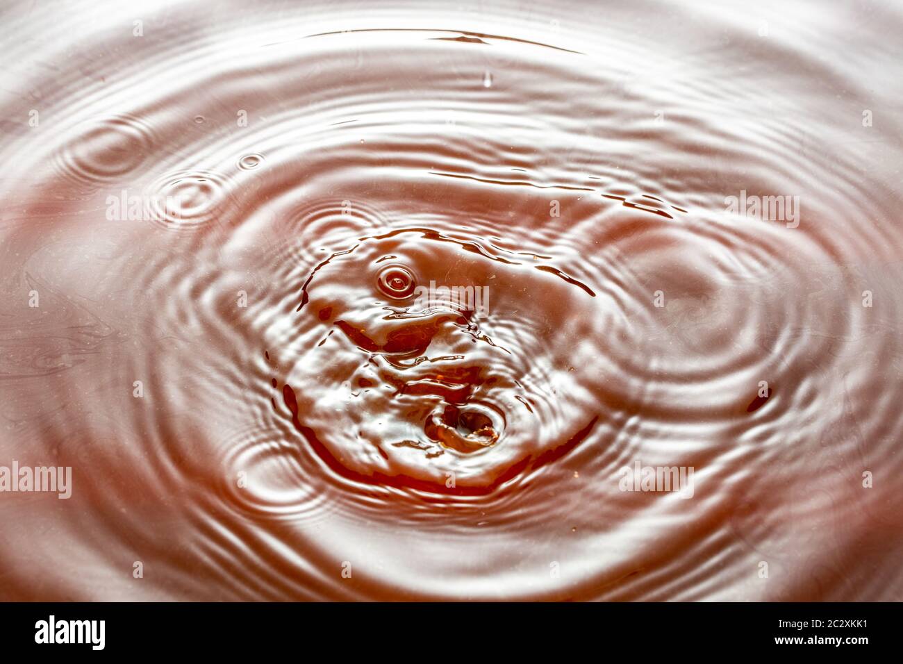 Rusty water drops splashing in dirty oily water, drops of stagnant ...