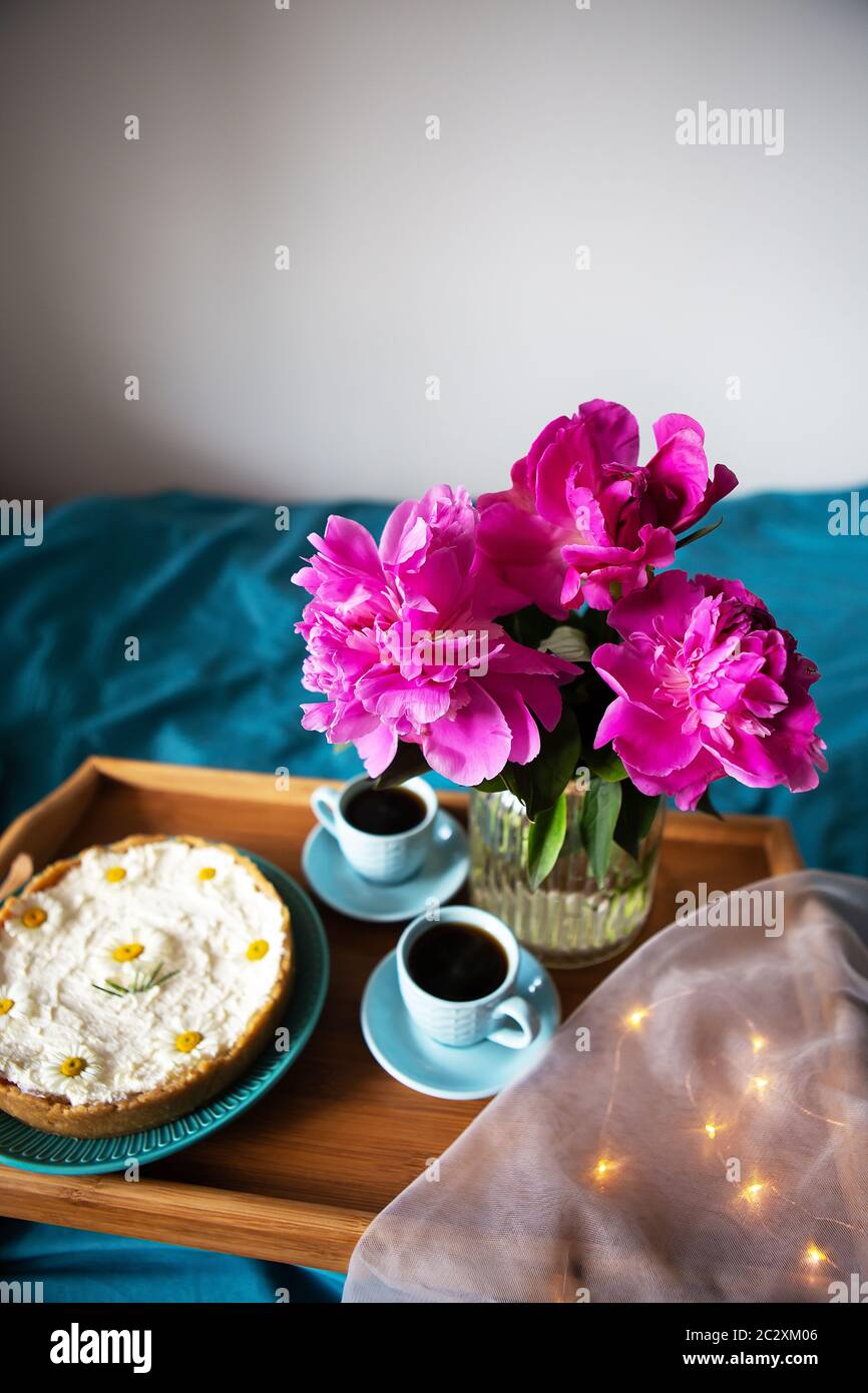 Beautiful morning Vanilla cheesecake, coffee, blue cups, pink peonies ...