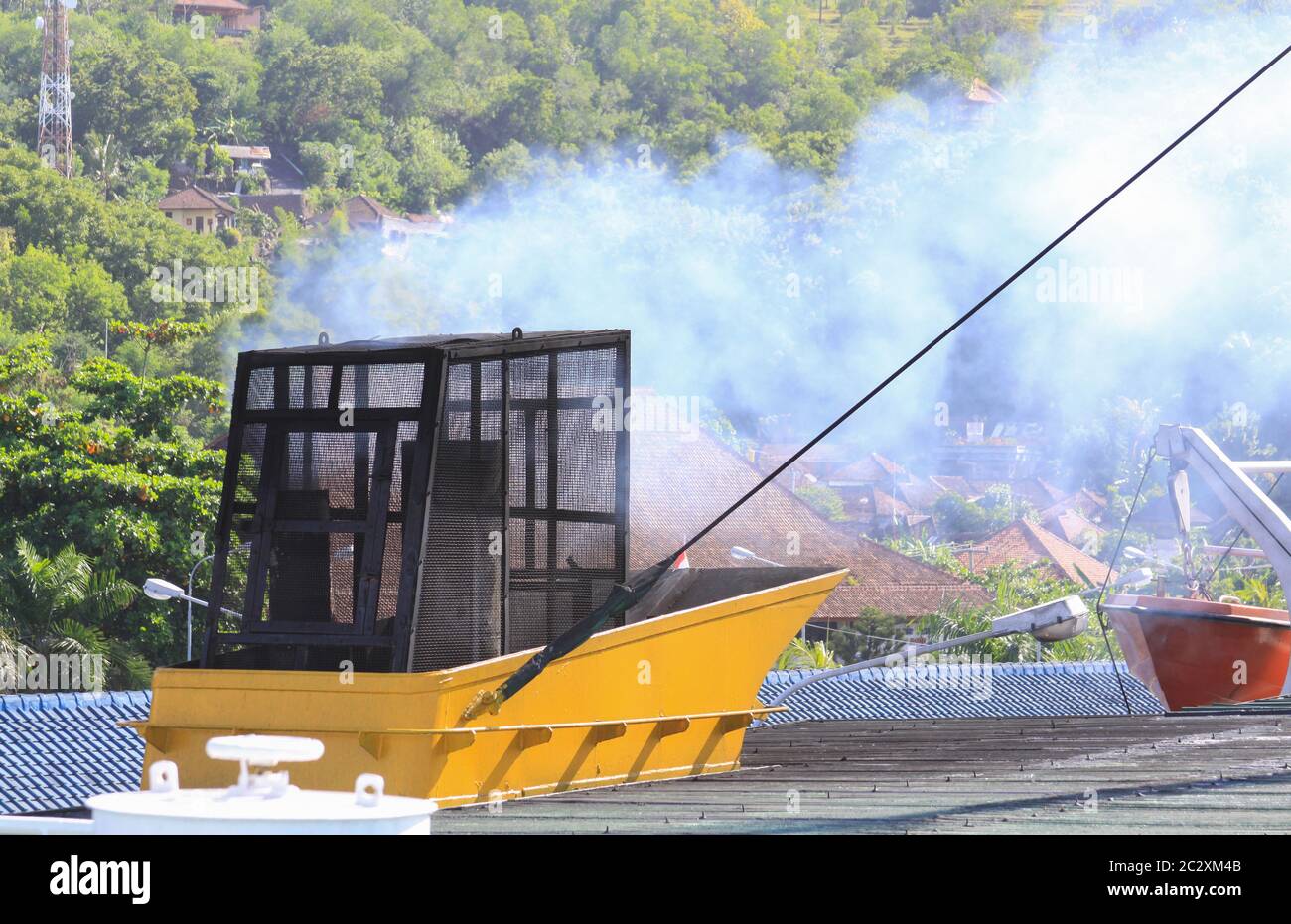 Pollution by engine exhaust of ferry in Indonesia. Diesel engine smoke ...