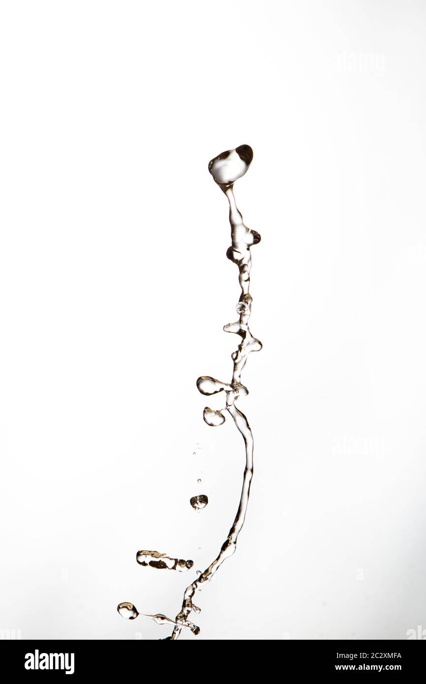 water droplets splashing against a white background Stock Photo - Alamy