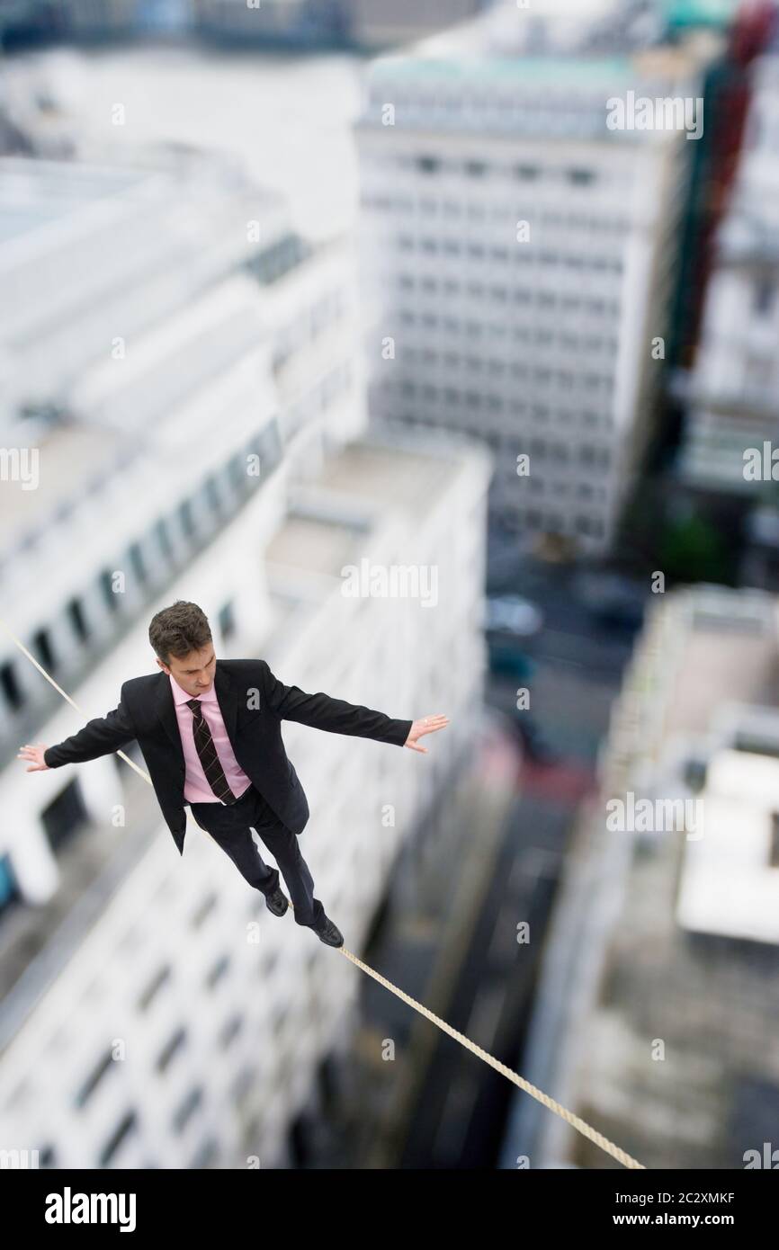 Businessman on tightrope hi-res stock photography and images - Alamy