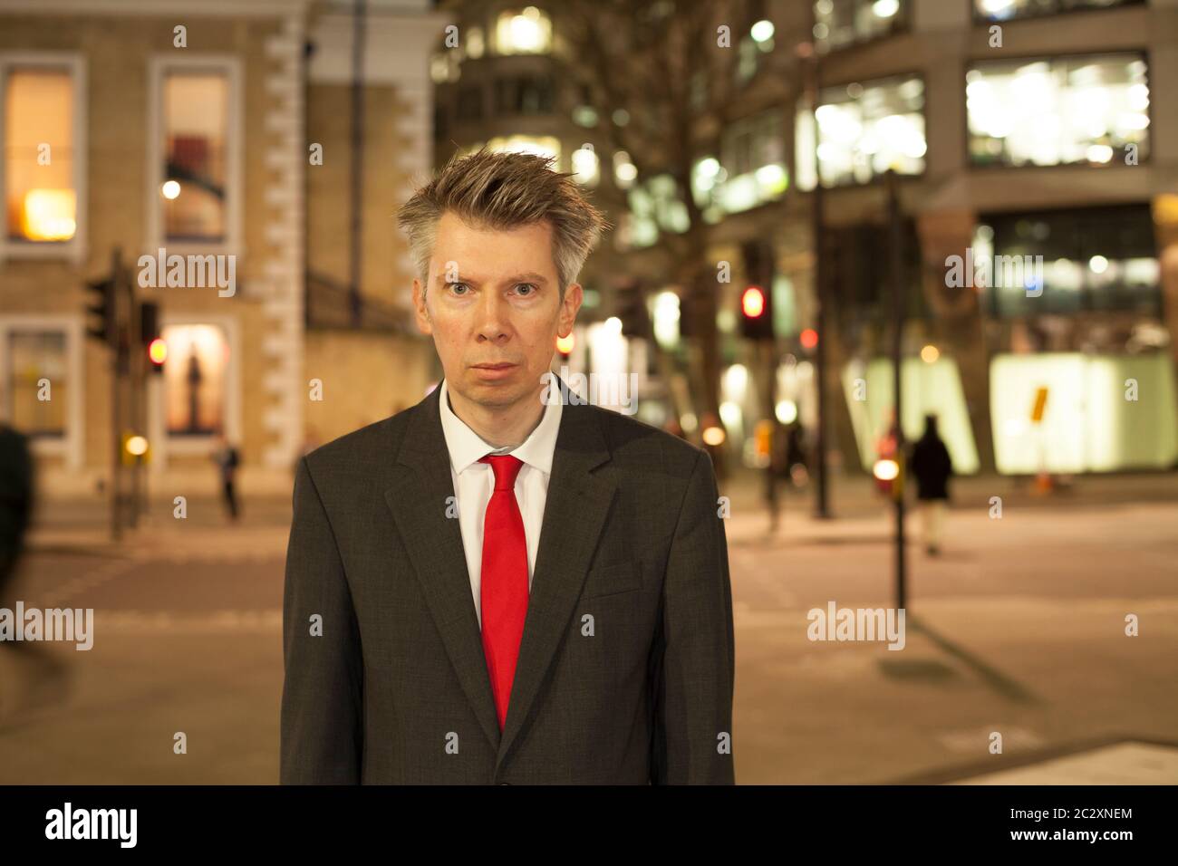 Businessman standing still Stock Photo - Alamy