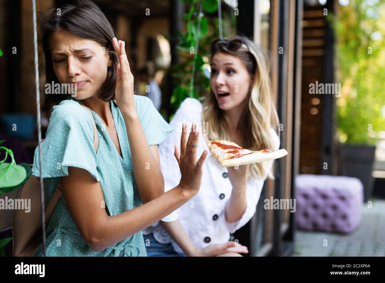 Woman rejecting unhealthy fast food because of gluten intolerance Stock ...