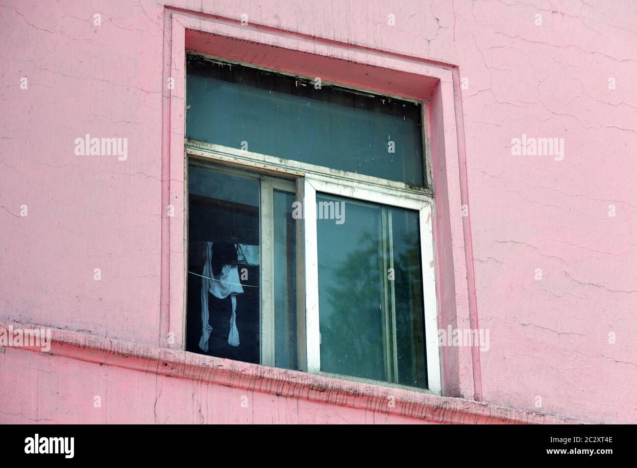 View through an open window inside a flat in a typical apartment house ...