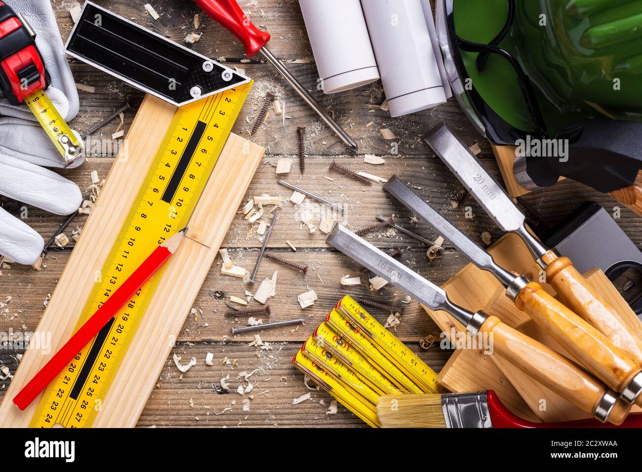 View from above of carpenter's tools on an antique wooden table ...