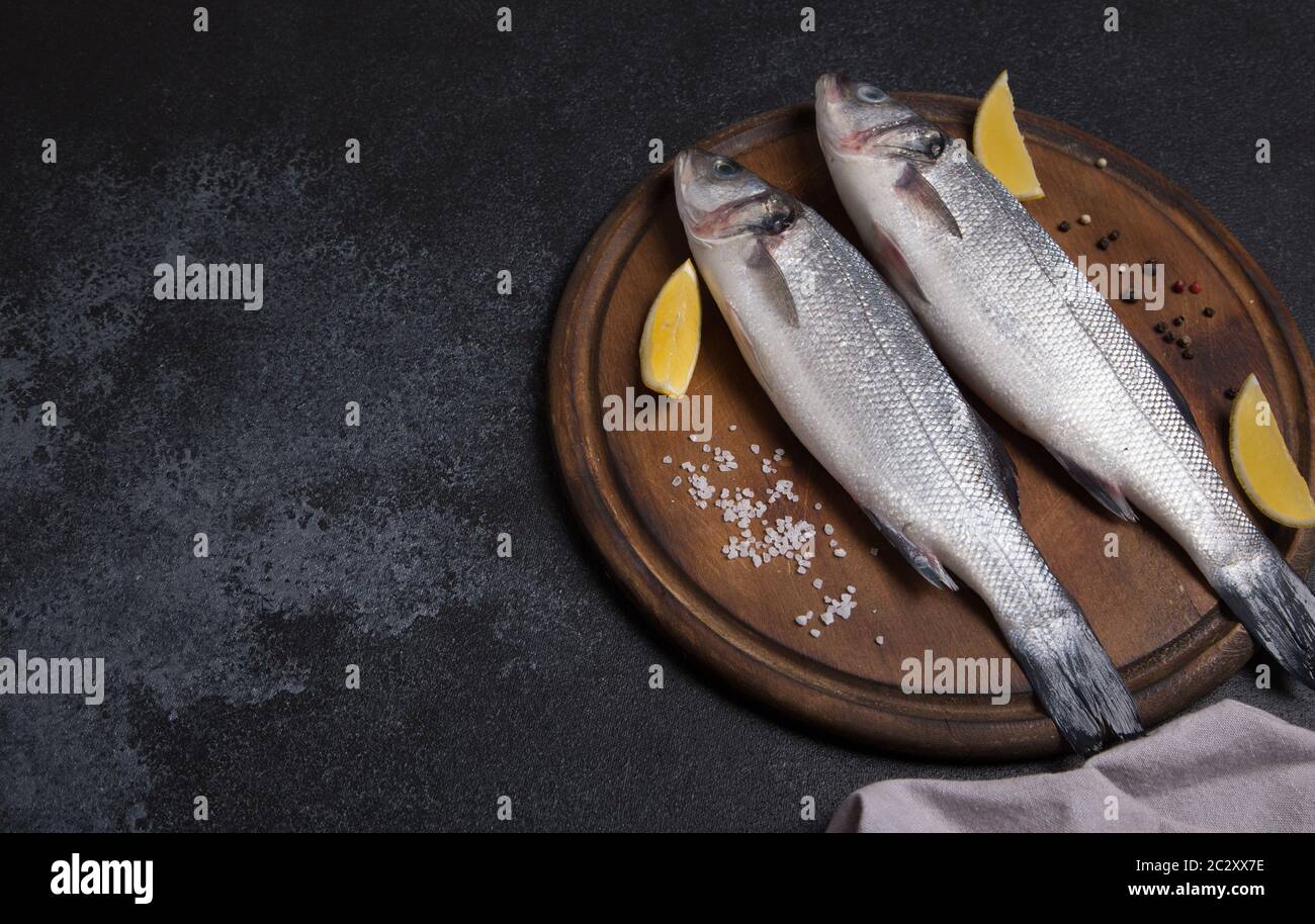 fresh raw whole sea bass. Raw seabass fish with spices and herbs ...