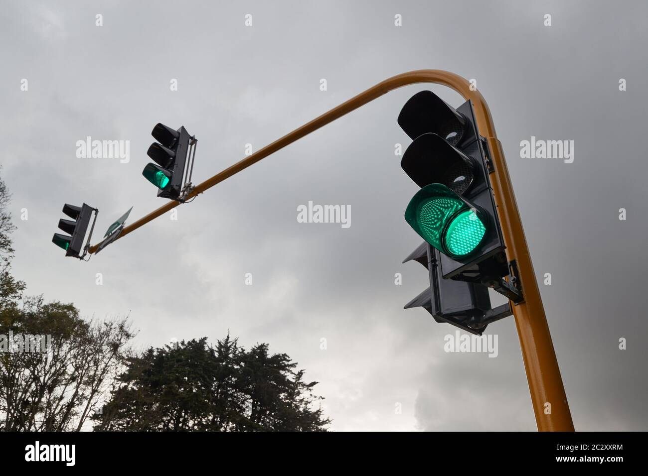 Overhead traffic lights at an intersection, green light Stock Photo - Alamy