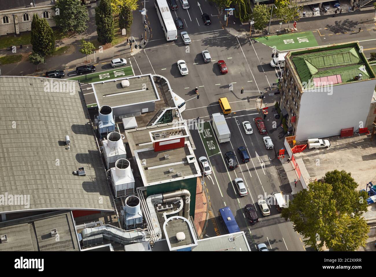 Urban road intersection with passing cars Stock Photo - Alamy