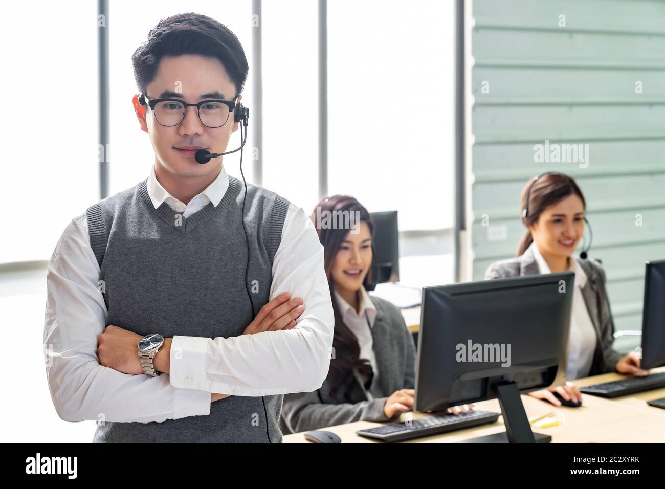 Smiling call Center team Stock Photo - Alamy