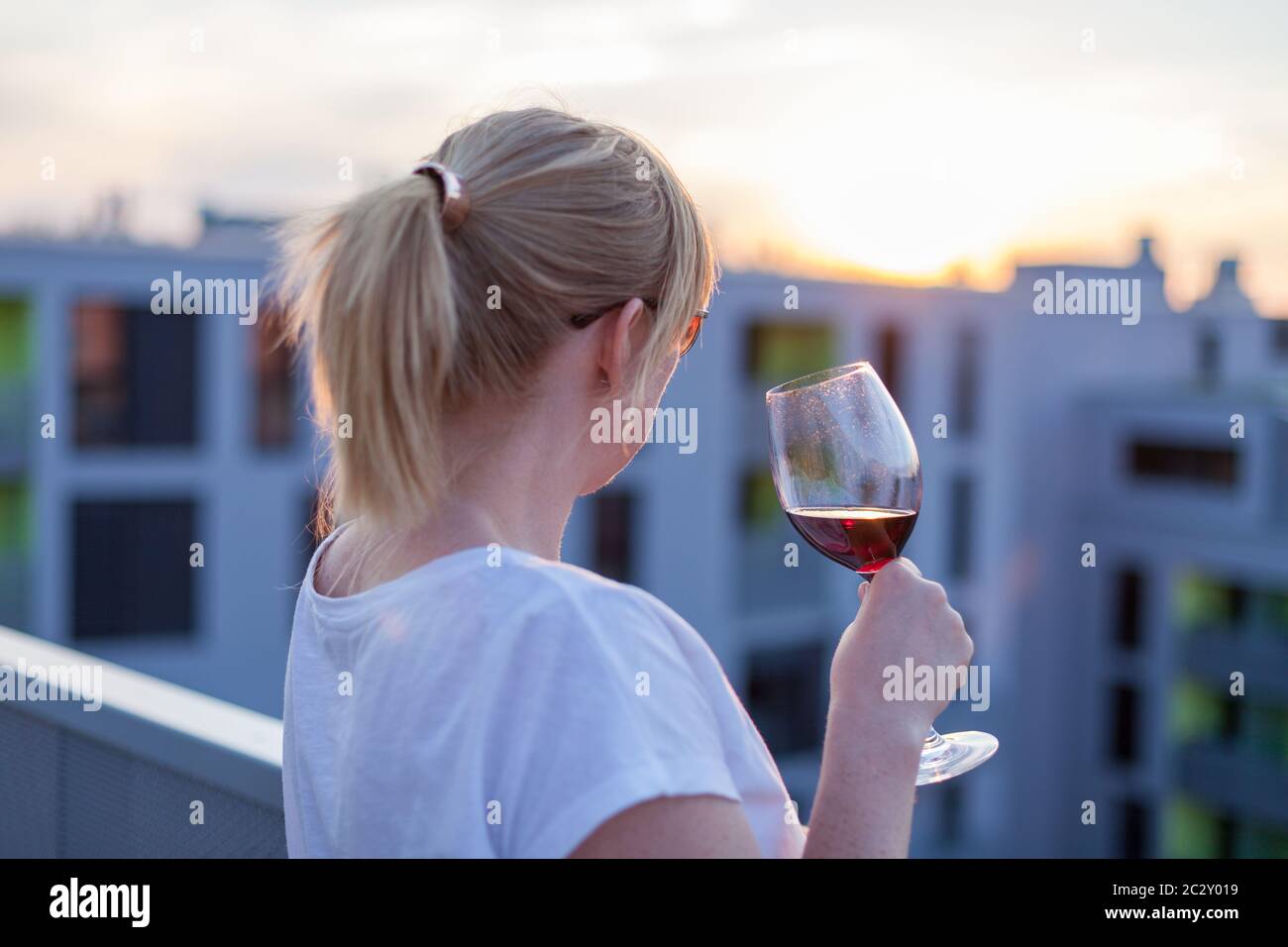 Woman on terrace holding hi-res stock photography and images - Alamy