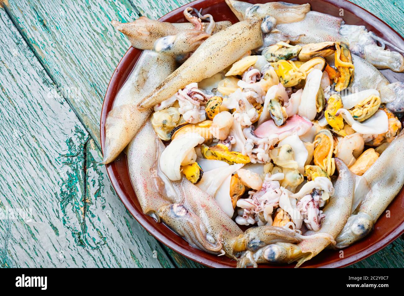 Raw seafood with fresh mussels,clams,squid, shrimps and spice.Healthy ...