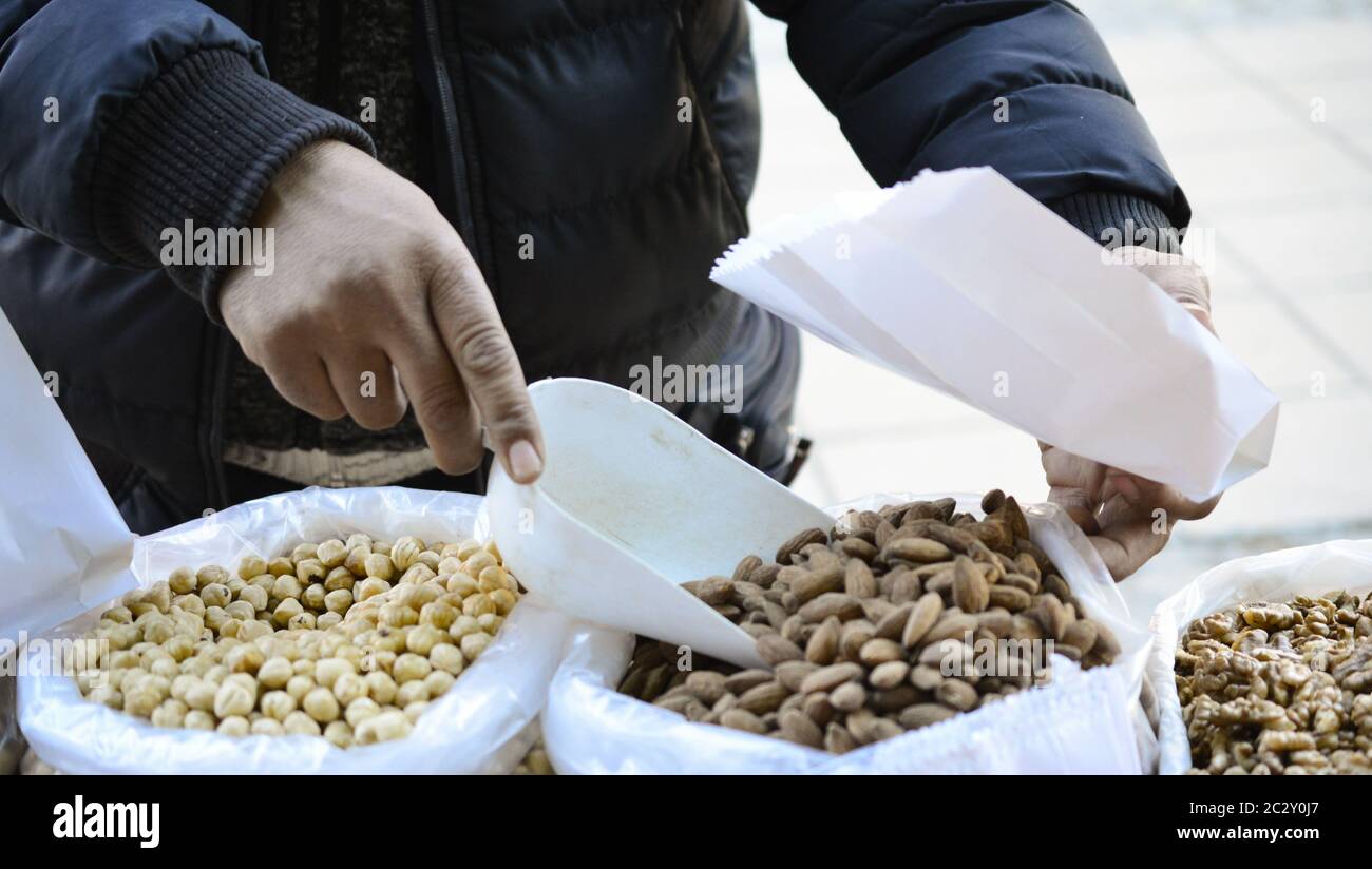 Man selling nuts on hi-res stock photography and images - Alamy