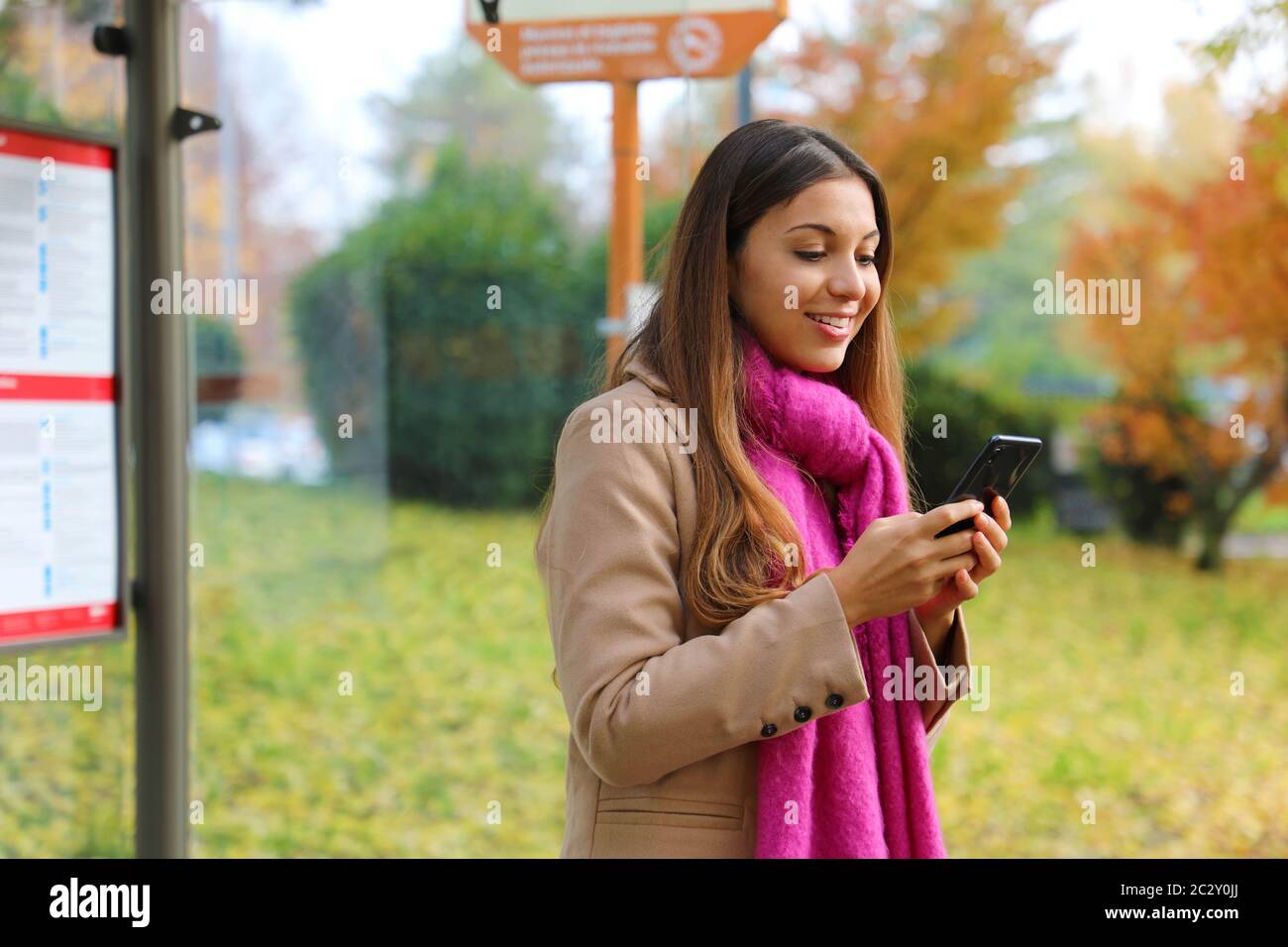 People and public transport. Young woman messaging with mobile phone ...